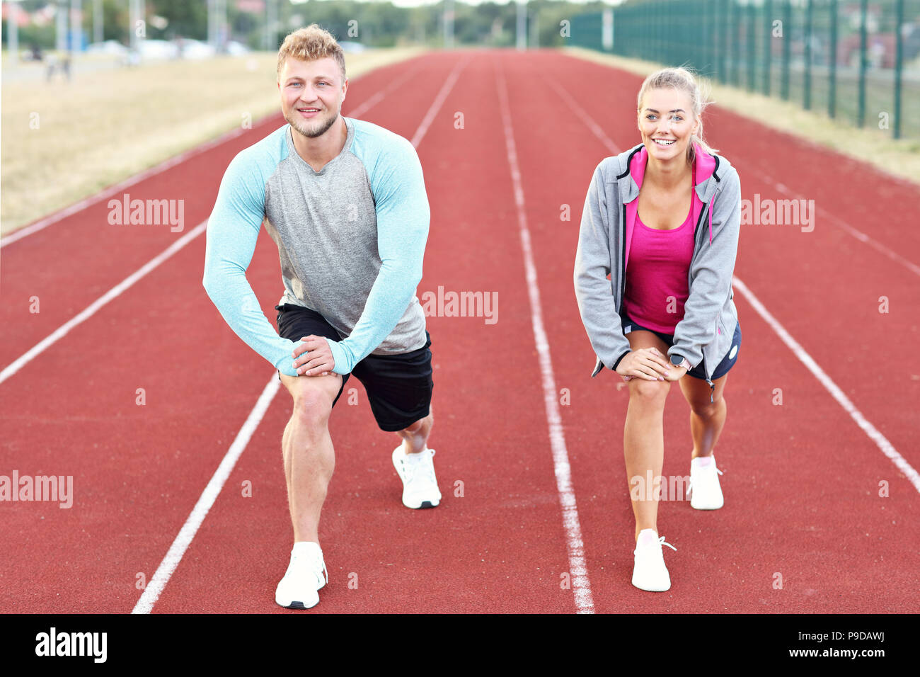 Picture showing man and woman racing on outdoor track Stock Photo - Alamy