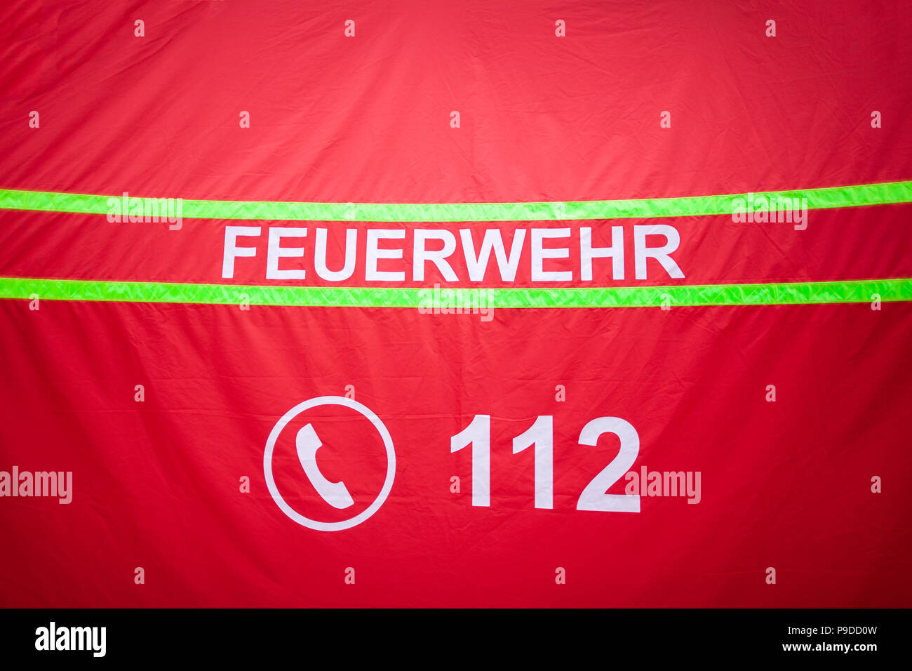 German fire department logo on a tent. The german word Feuerwehr means ...