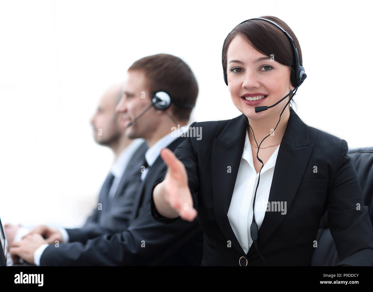 Manager of call center reaches out to shake hands Stock Photo - Alamy
