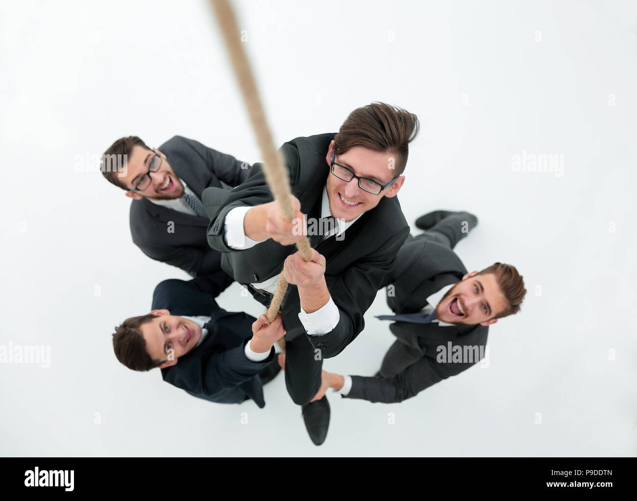 business team helping the leader to climb the rope Stock Photo - Alamy