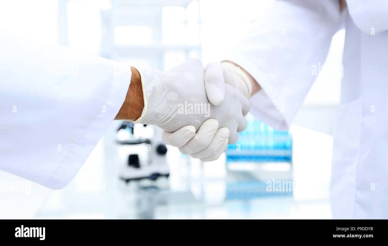 Medical gloves make shaking hands Stock Photo - Alamy