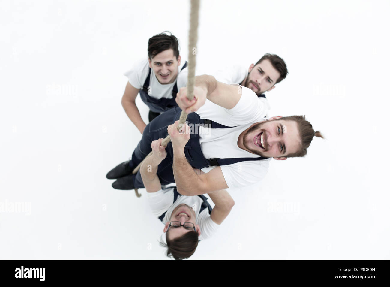 view from the top.smiling engineer ,climbing up the rope Stock Photo ...
