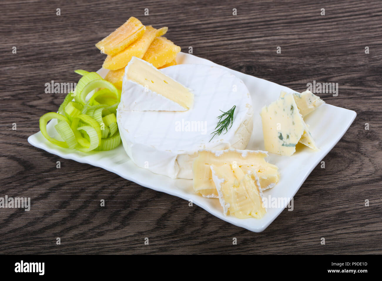 Cheese platter with brie, blue and parmesan Stock Photo - Alamy