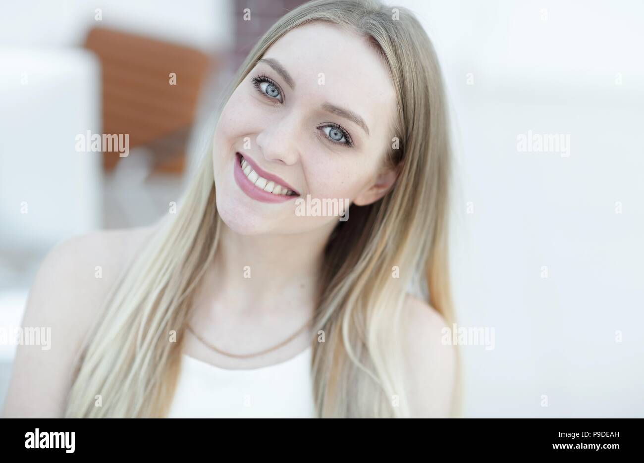 close-up portrait of a young woman on a blurred office background Stock ...