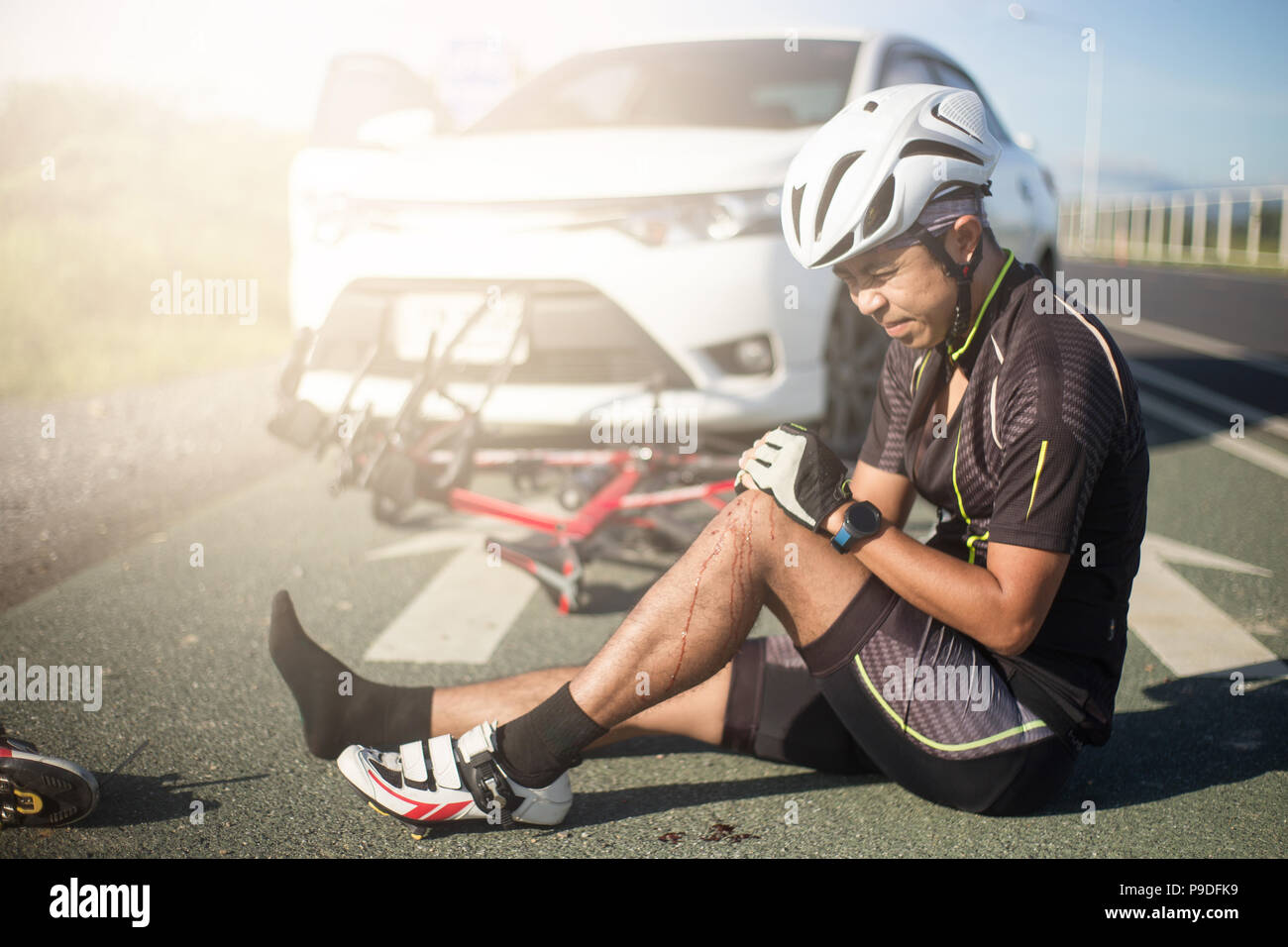 Asia cyclist injured on the street bike after collision accident car ...