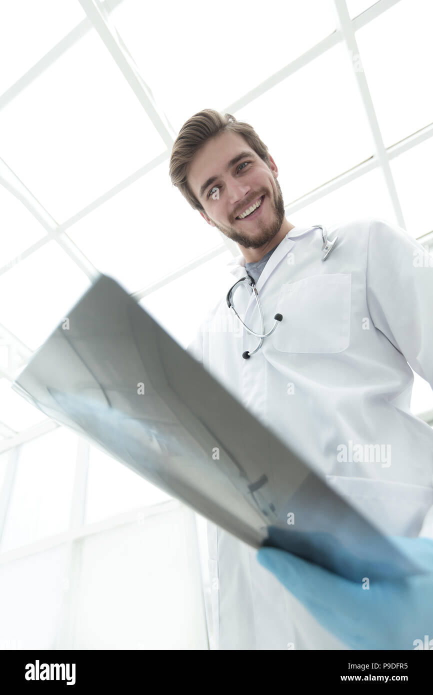 smiling doctor showing x-ray Stock Photo - Alamy