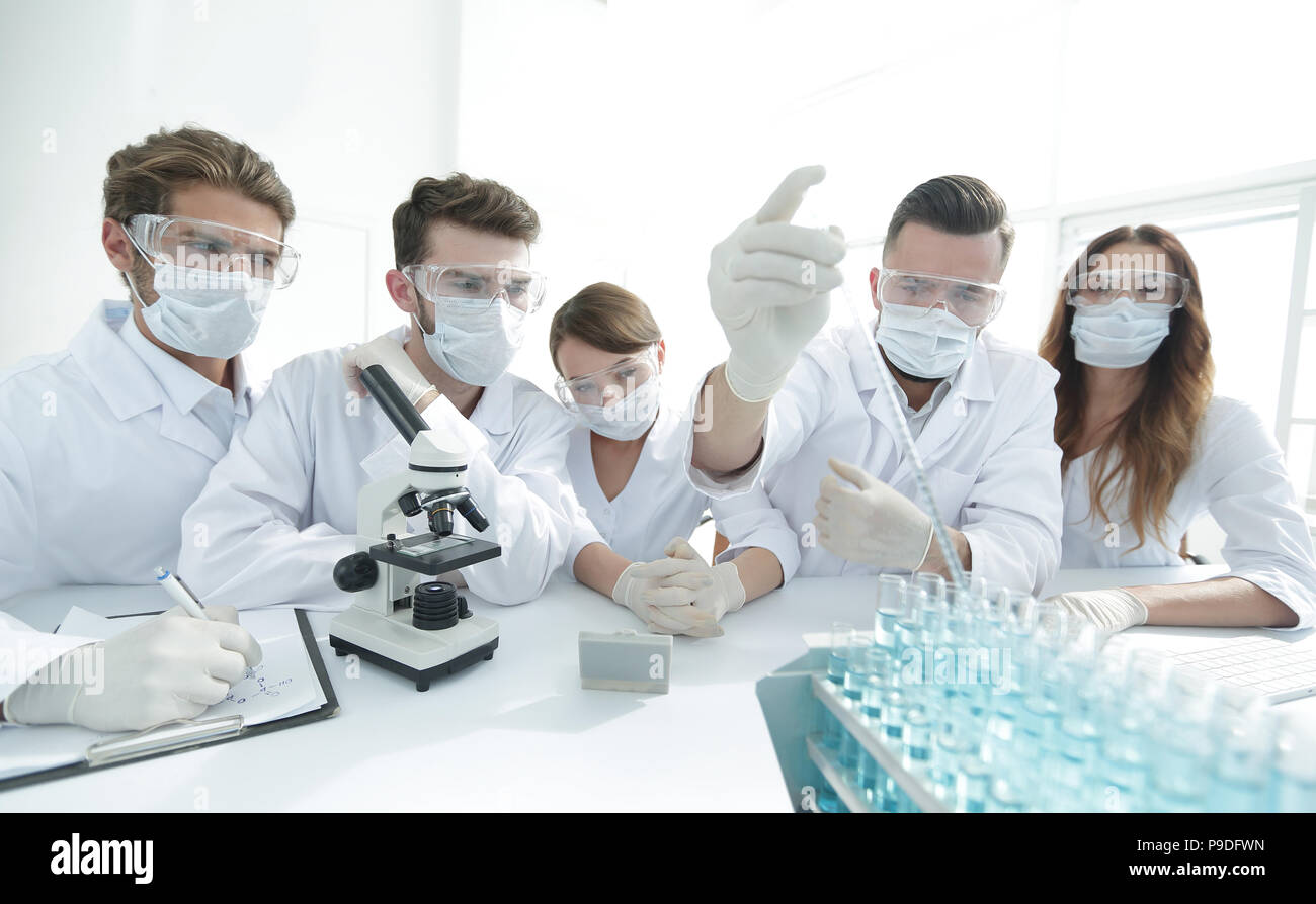 Scientists at chemical laboratory during work Stock Photo - Alamy
