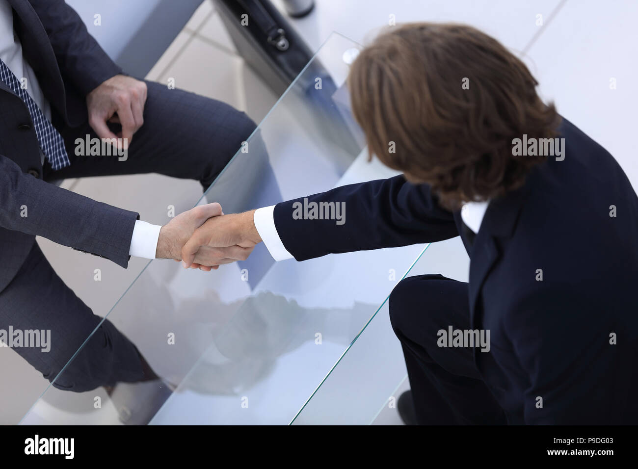 colleagues shaking hands in office Stock Photo - Alamy