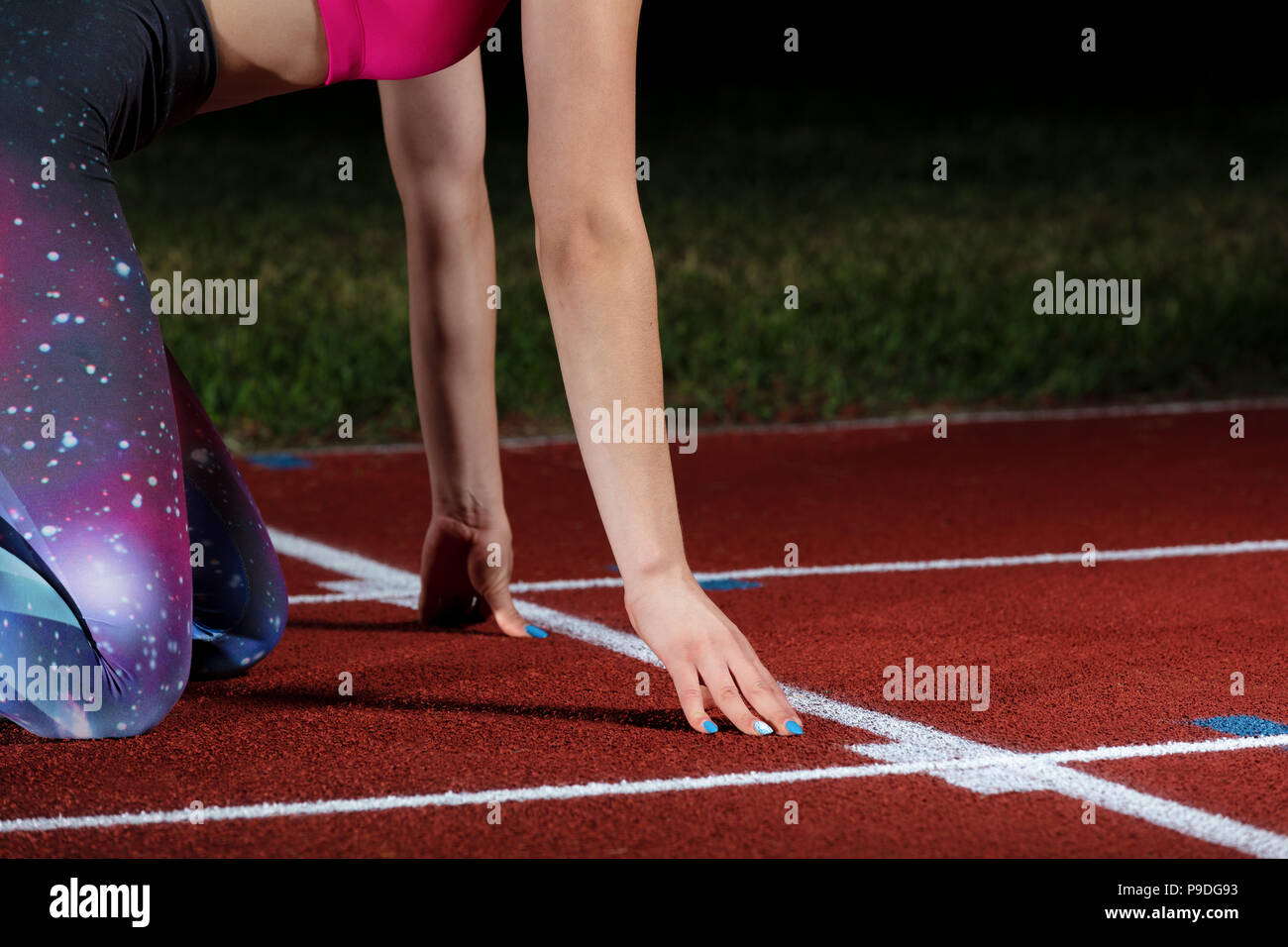 Female sprinter leaving starting blocks hi-res stock photography and ...