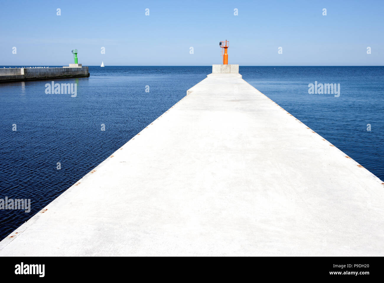 View of the lighthouse, a boat and the sea Stock Photo - Alamy