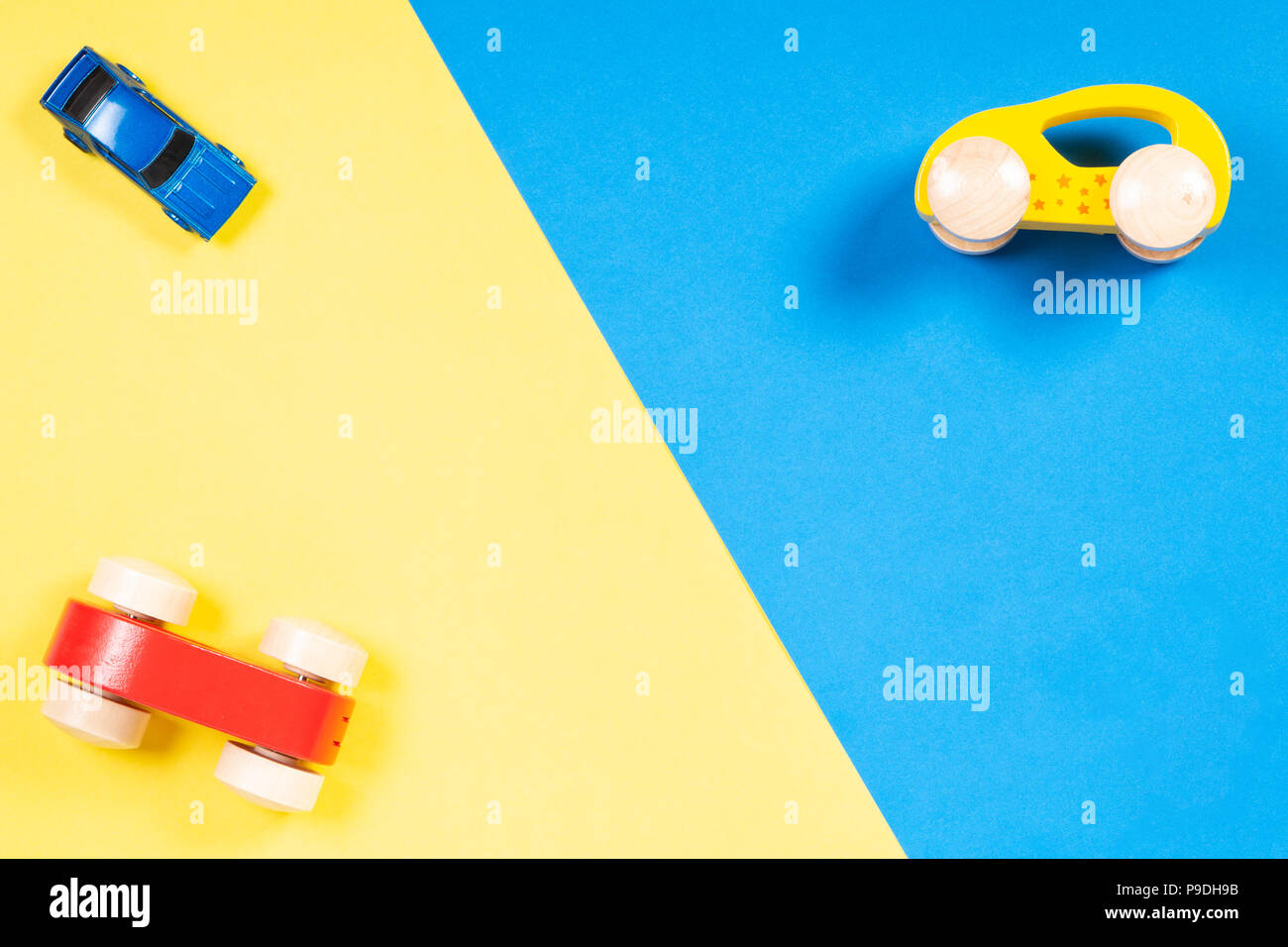 Colorful toy cars on blue and yellow background Stock Photo - Alamy