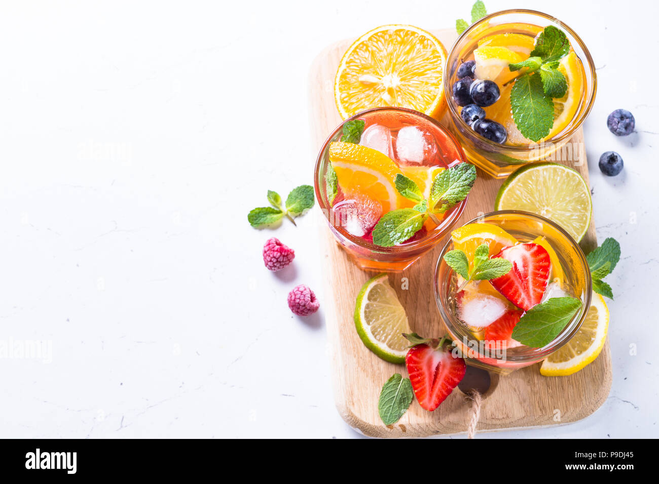 Lemonade set. Cold summer drink assortment. Lemonade, mojito and berry ...