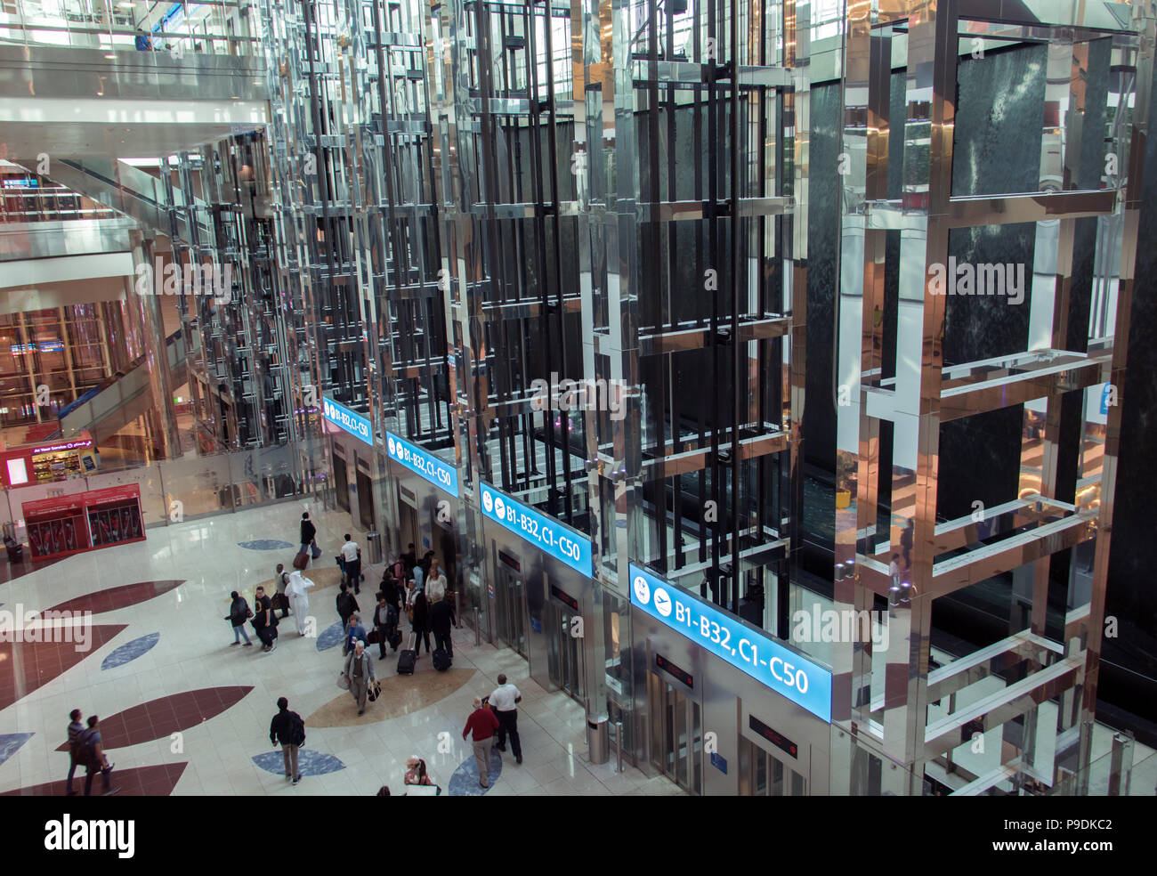 Large modern lift in the hall. People using lifts at the airport Stock ...