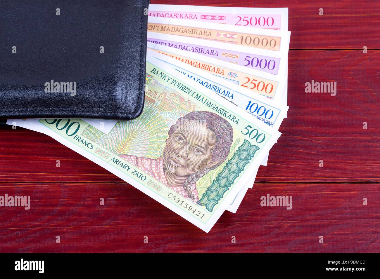 Malagasy Ariary in the black wallet Stock Photo - Alamy