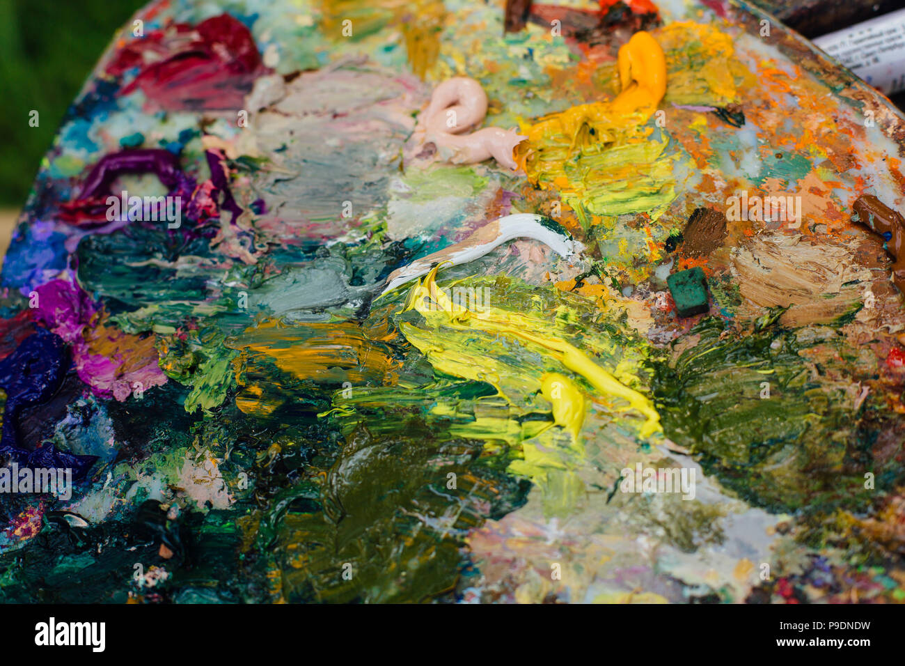 Palette with oil paints. Close up of different color oil paint Stock ...