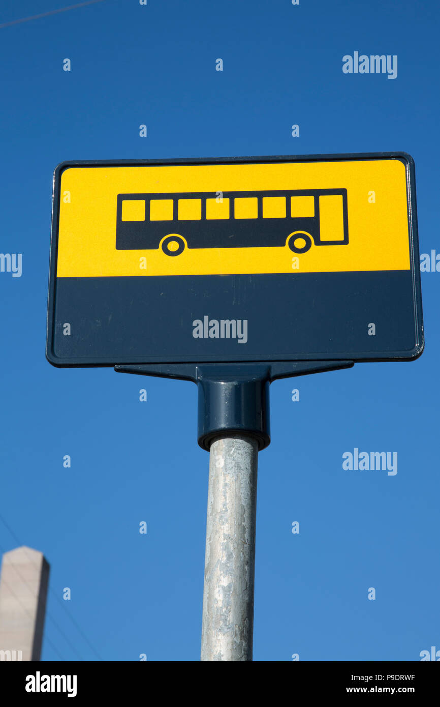 Yellow Bus Sign against Blue Sky Background Stock Photo - Alamy