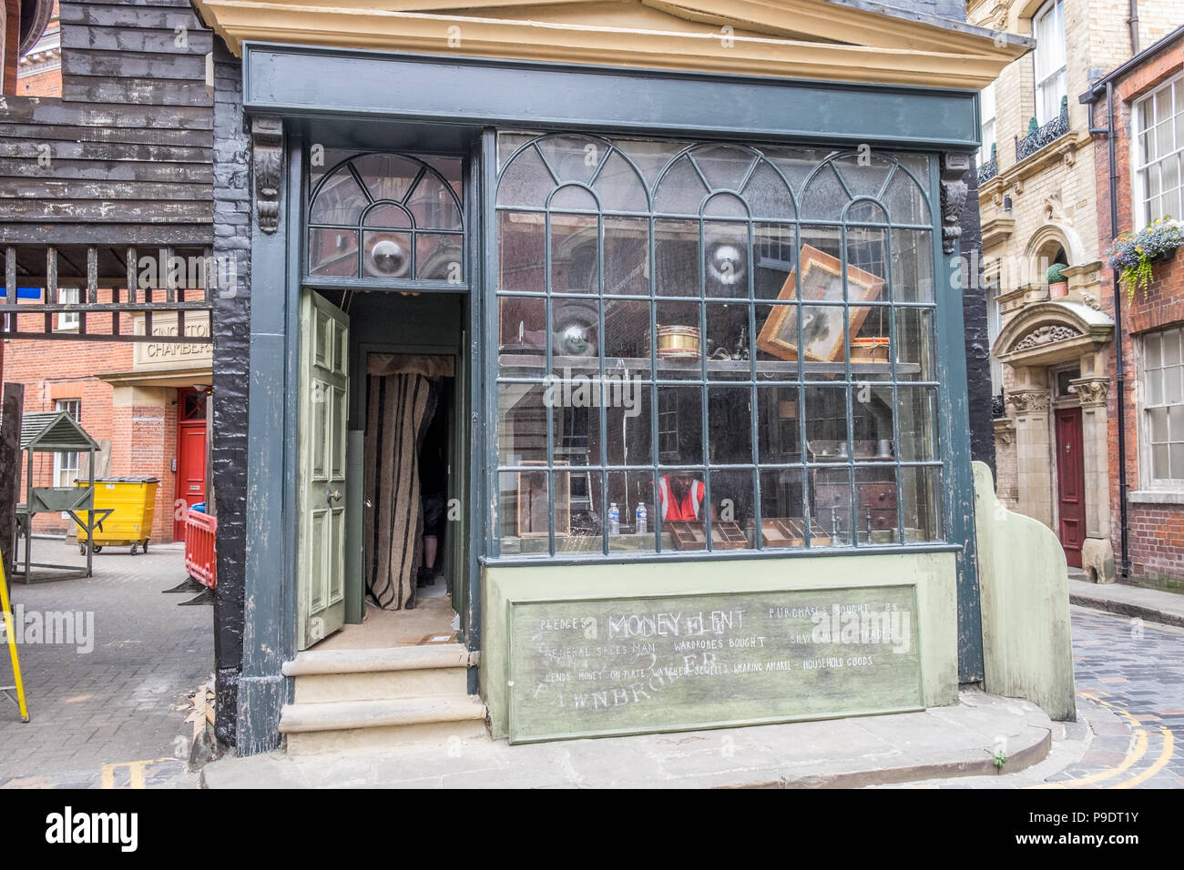 A film set, setting up and building false fronts to shops and windows ...