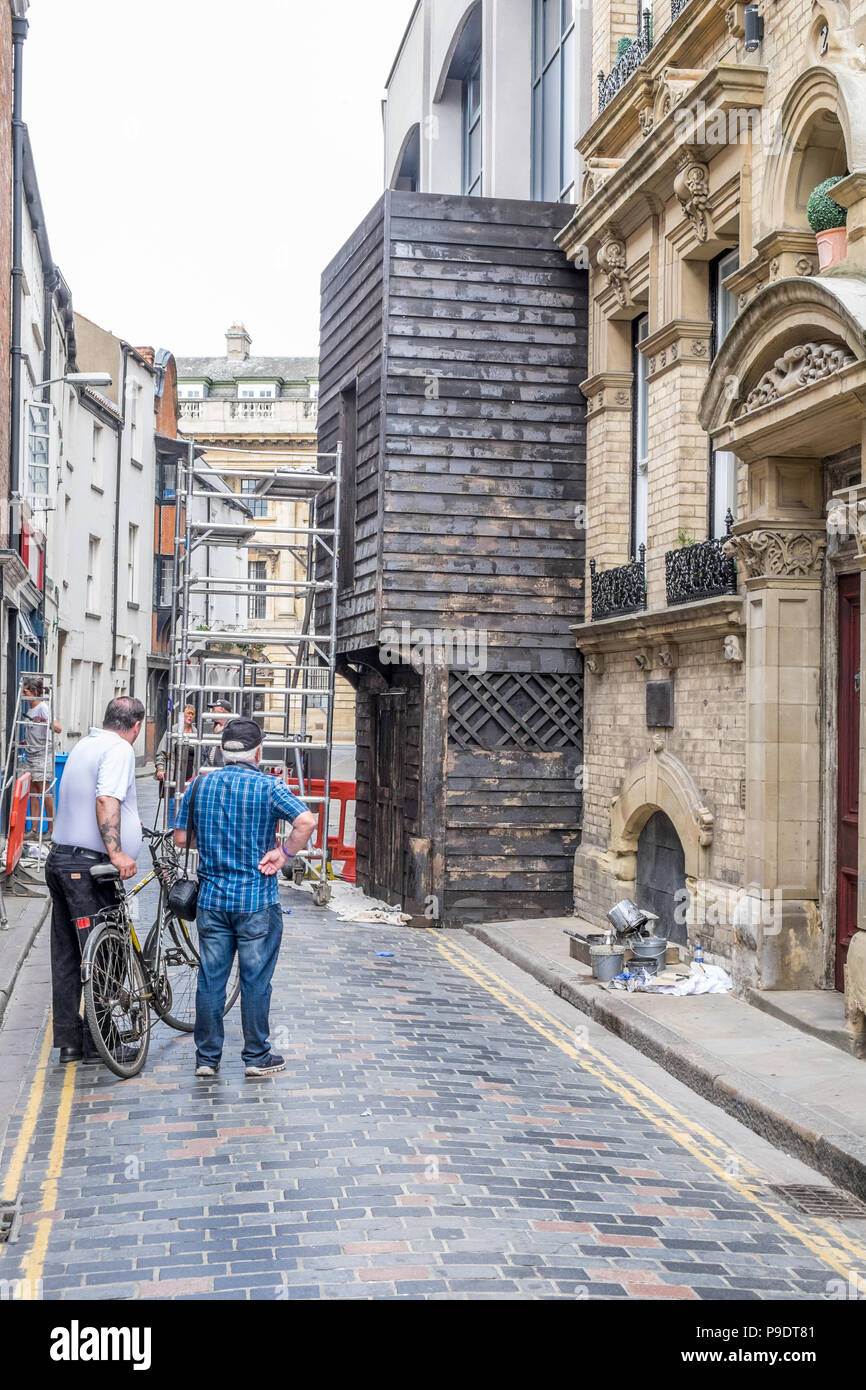 A film set, setting up and building false fronts to shops and windows ...