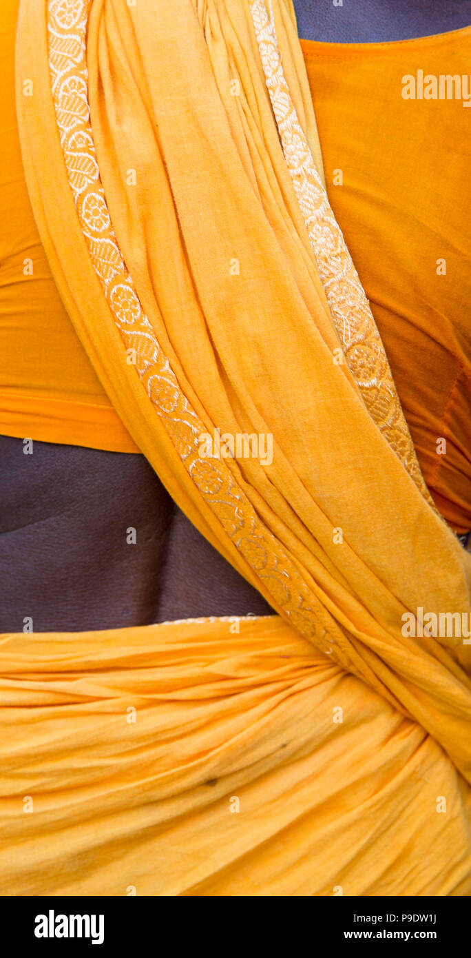 back of indian girl in yellow saree, close-up Stock Photo - Alamy