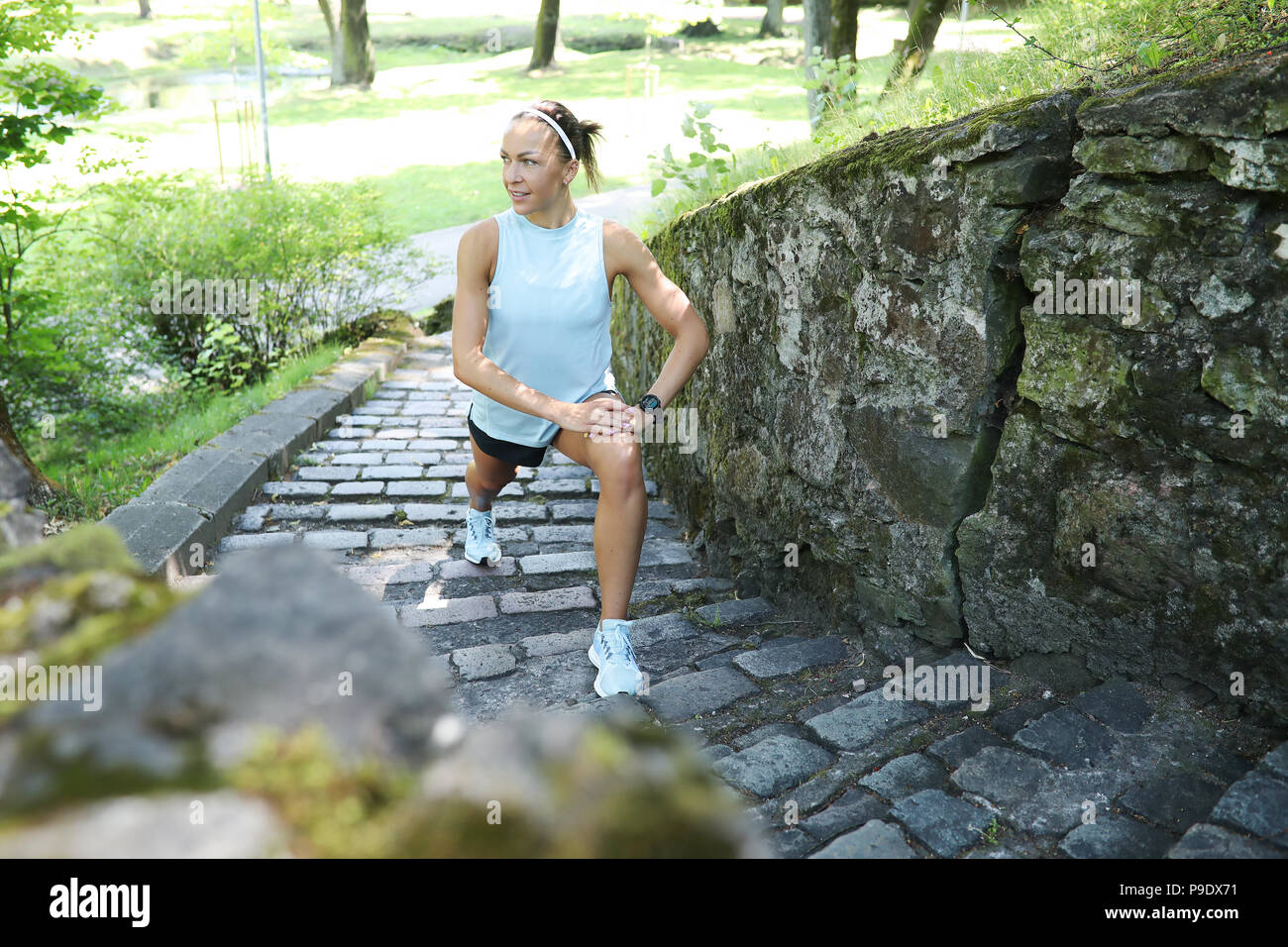 Outdoor workout. Exercise in the park Stock Photo - Alamy