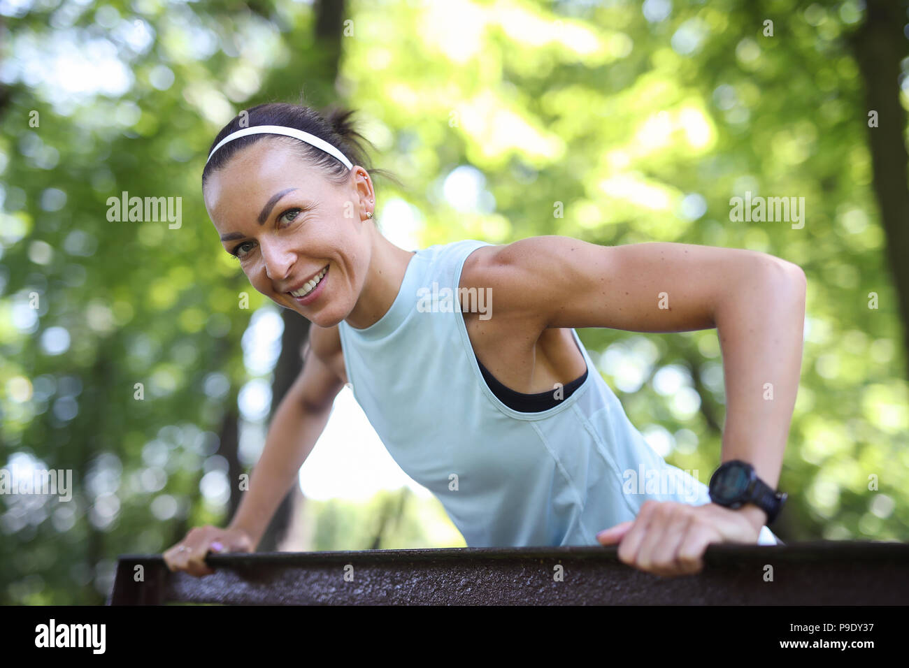 Outdoor workout. Exercise in the park Stock Photo - Alamy