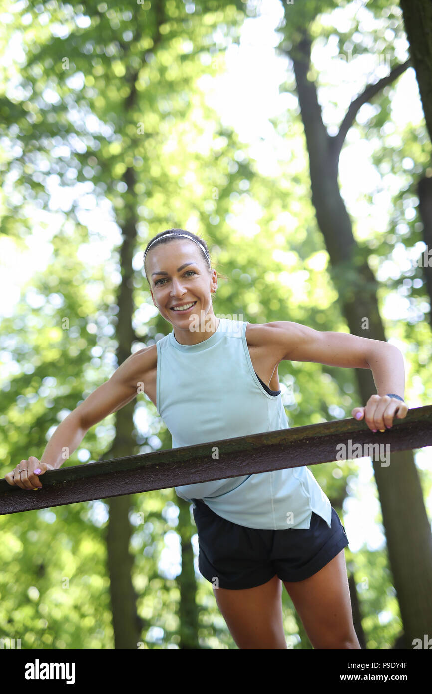 Outdoor workout. Exercise in the park Stock Photo - Alamy