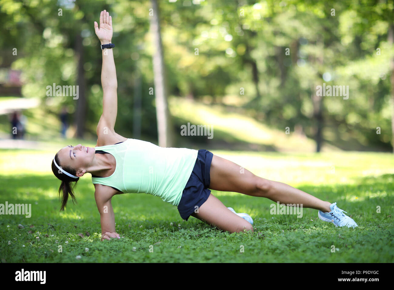 Outdoor workout. Exercise in the park Stock Photo - Alamy