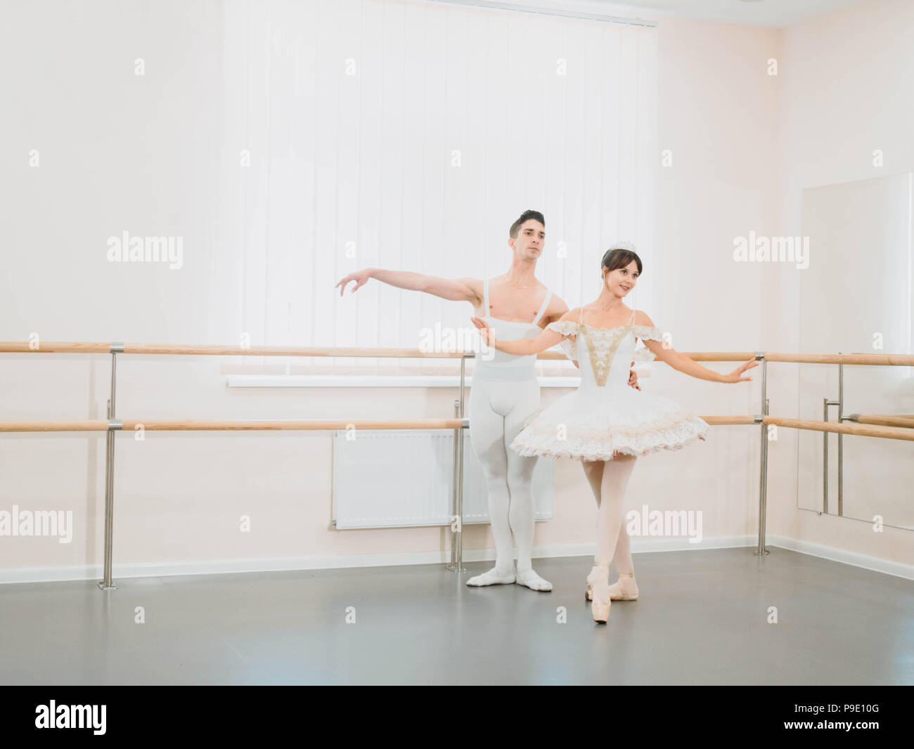 Professional, emotional ballet dancers practicing in the gym or hall ...