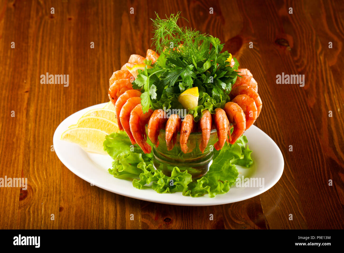 Prawn cocktail served lemon and parsley Stock Photo - Alamy