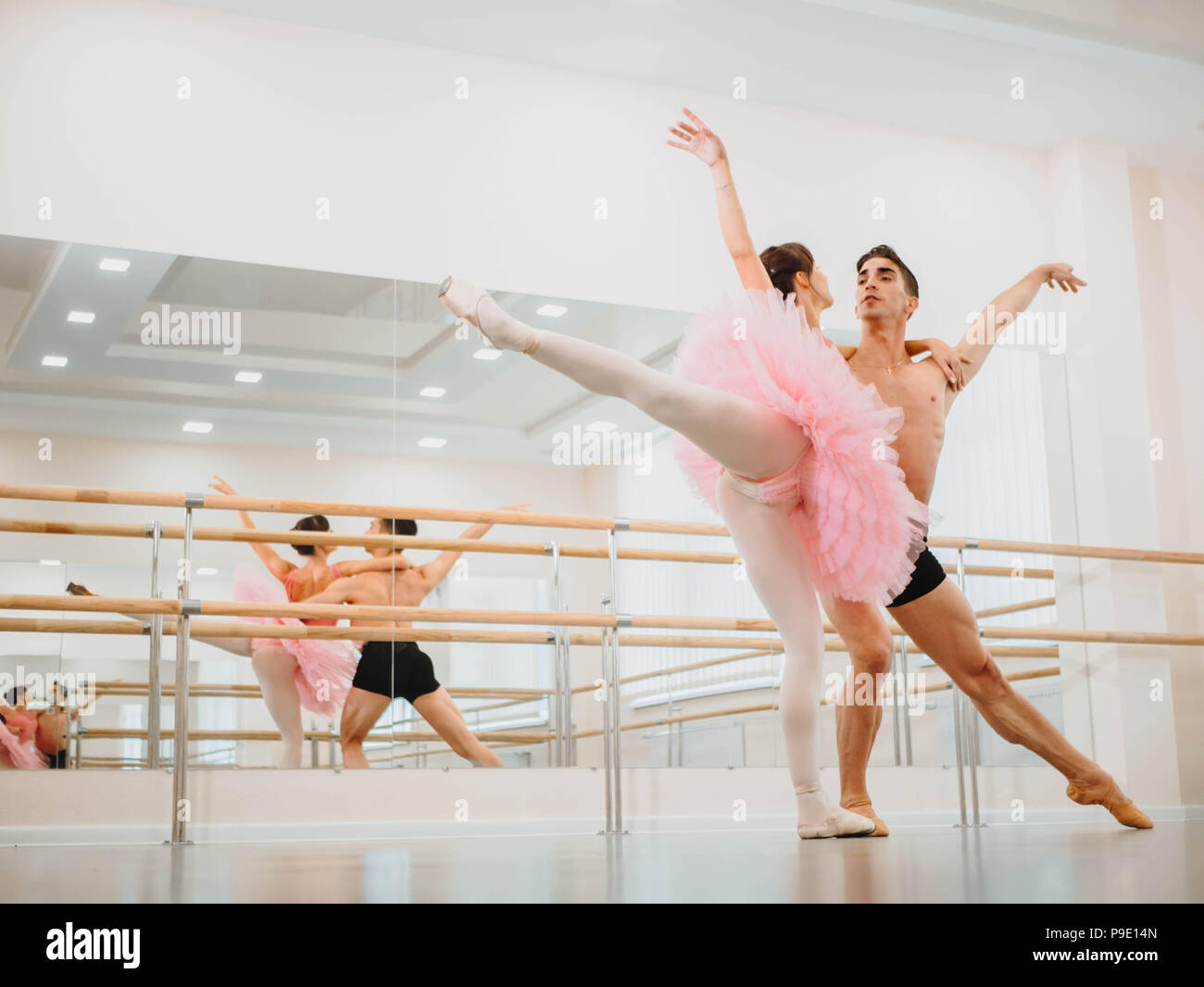 Professional, emotional ballet dancers practicing in the gym or hall ...