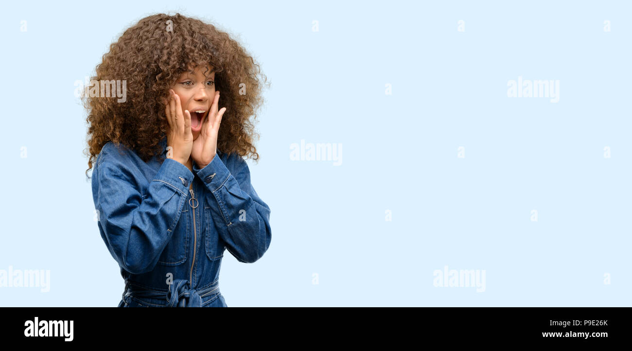 African american woman wearing blue jumpsuit stressful keeping hands on ...