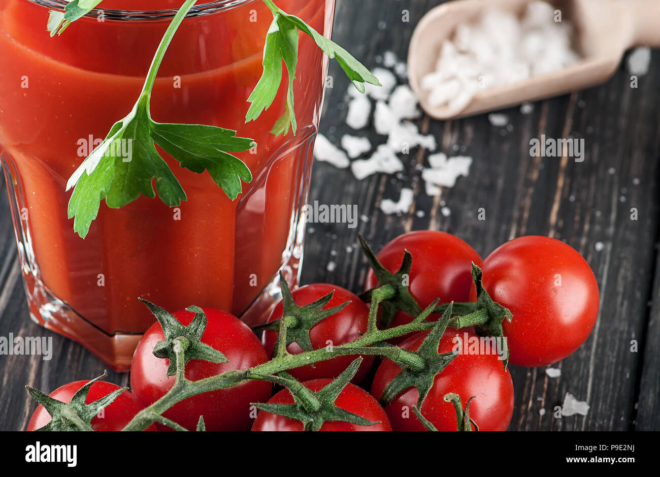 Closeup of tomato juice and cherry tomatoes Stock Photo - Alamy