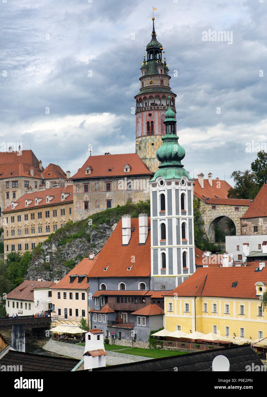 Cesky Krumlov castle and ancient historical houses and sky with stormy ...