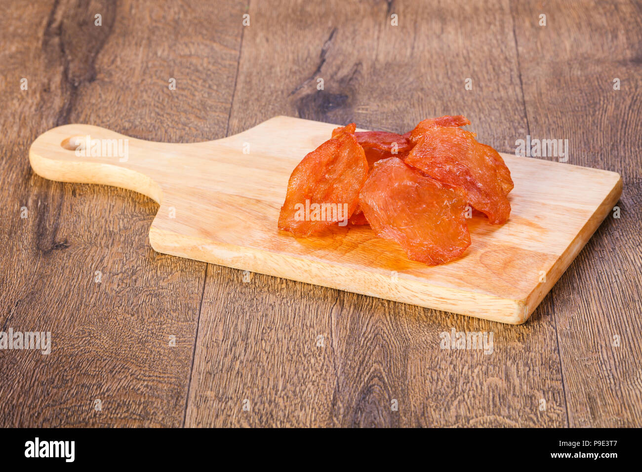 Dry chicken meat over wooden Stock Photo - Alamy