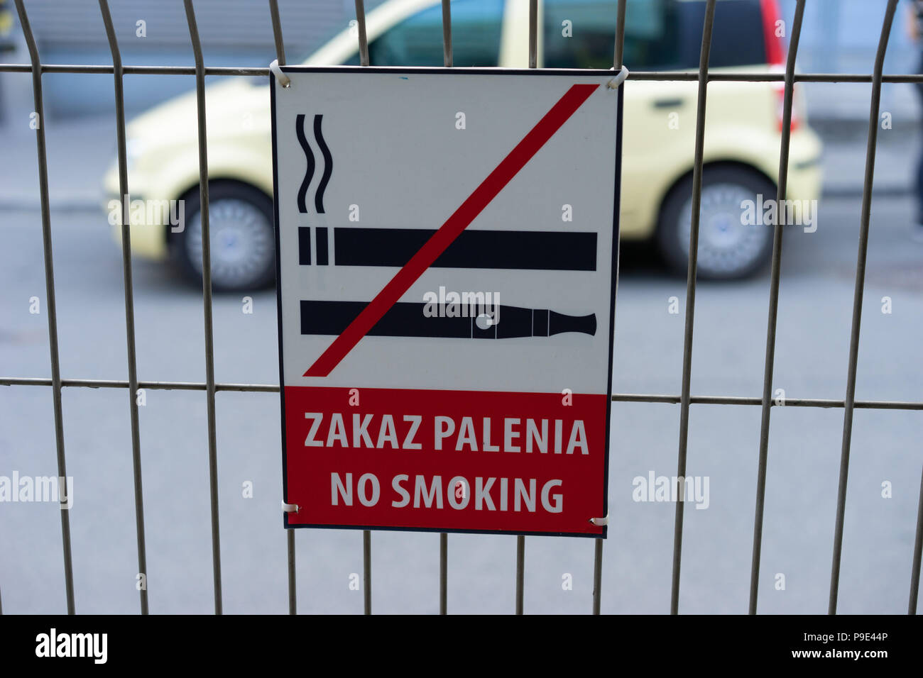 No smoking sign on a wire fence in Krakow, Poland Stock Photo - Alamy