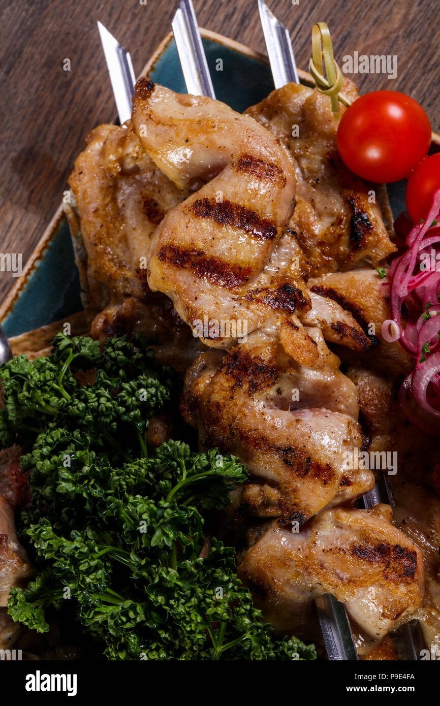 Grilled chicken and pork barbeque Stock Photo - Alamy