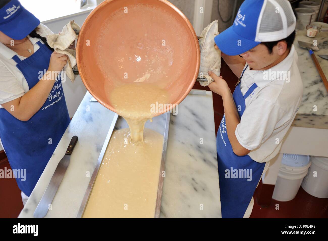 World famous fudge making, pouring the hot fudge from copper kettle, at ...