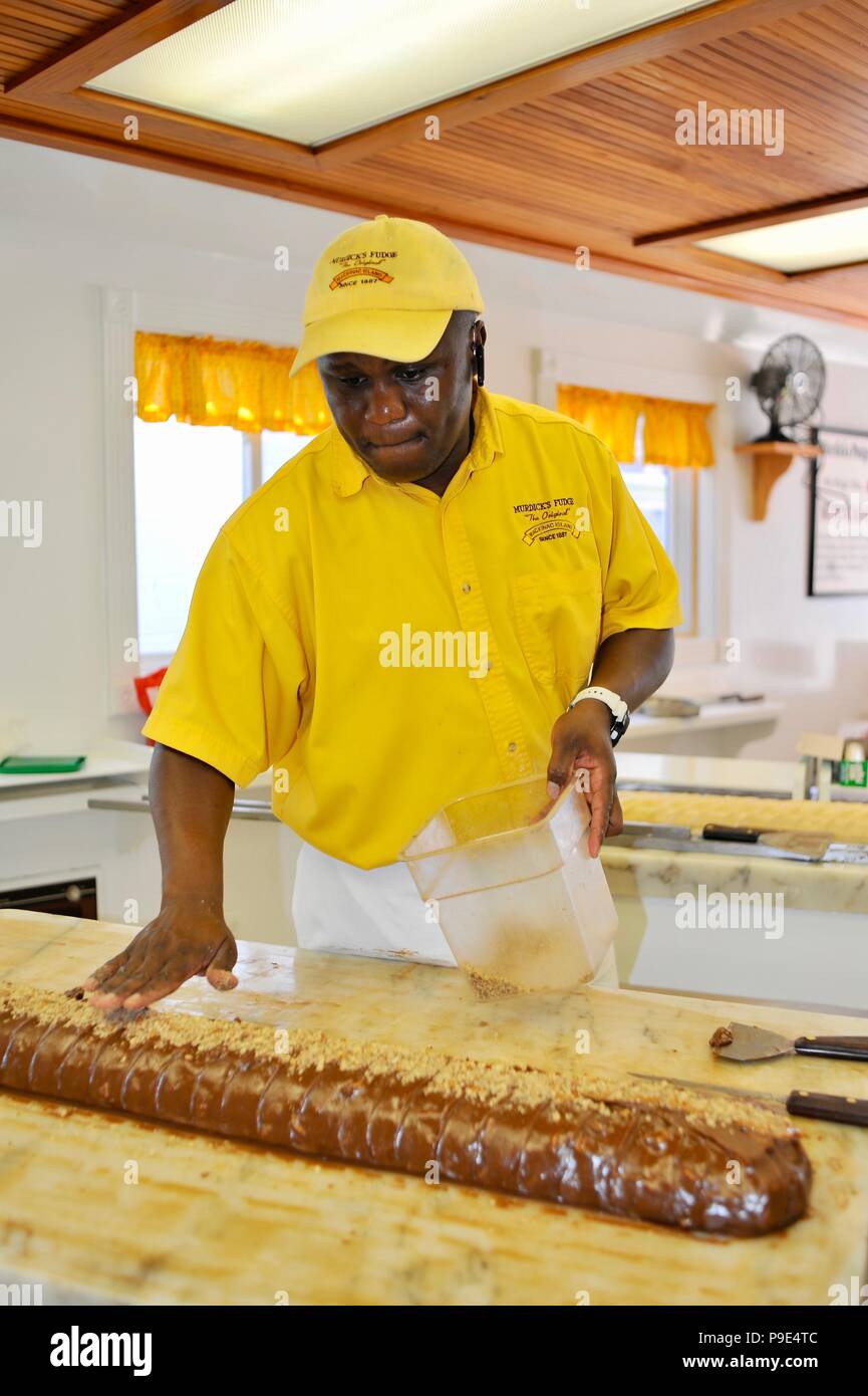 World famous fudge making at Murdick's Fudge (since 1887) by an African ...