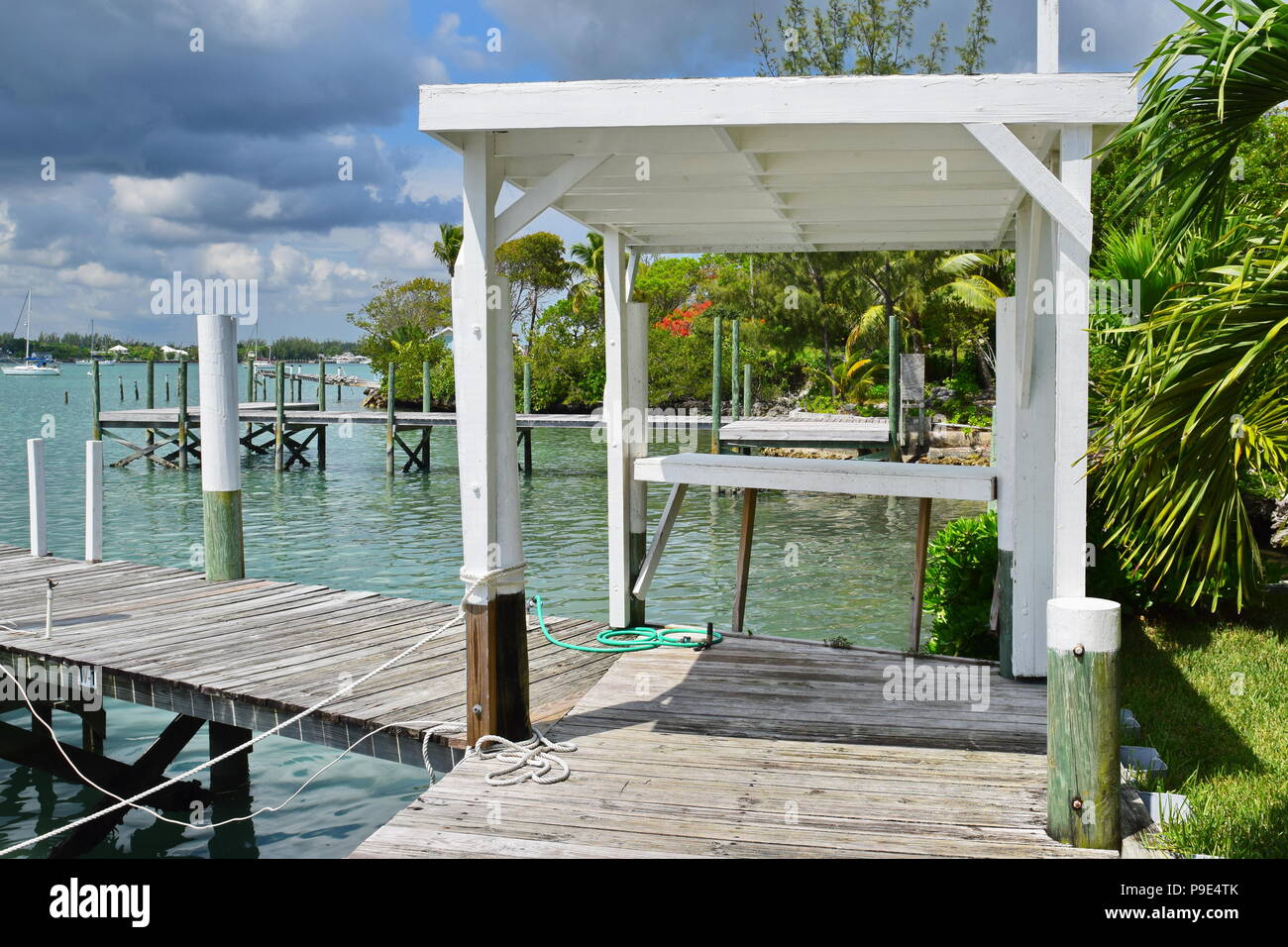 White shelter roof over pier and dock on the ocean in Marsh Harbour ...