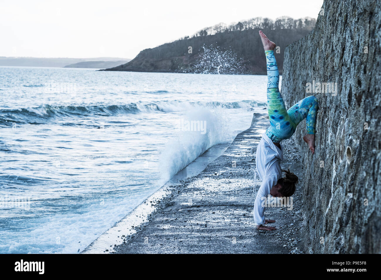 Woman doing handstand beach hi-res stock photography and images - Alamy