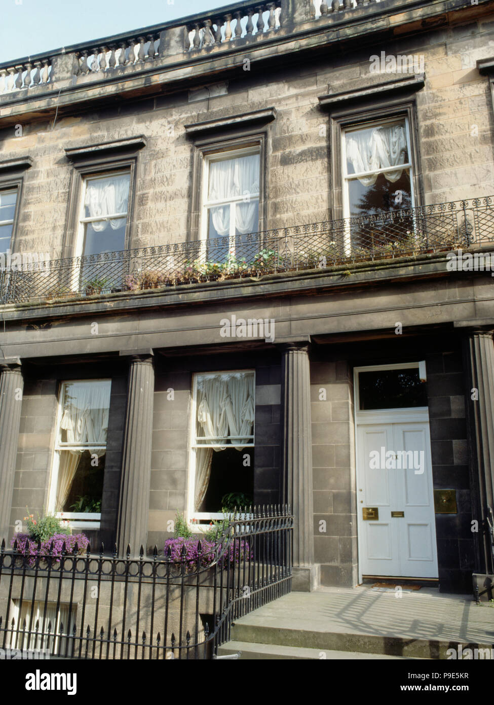 Exterior of terraced Regency townhouse with white front door Stock ...
