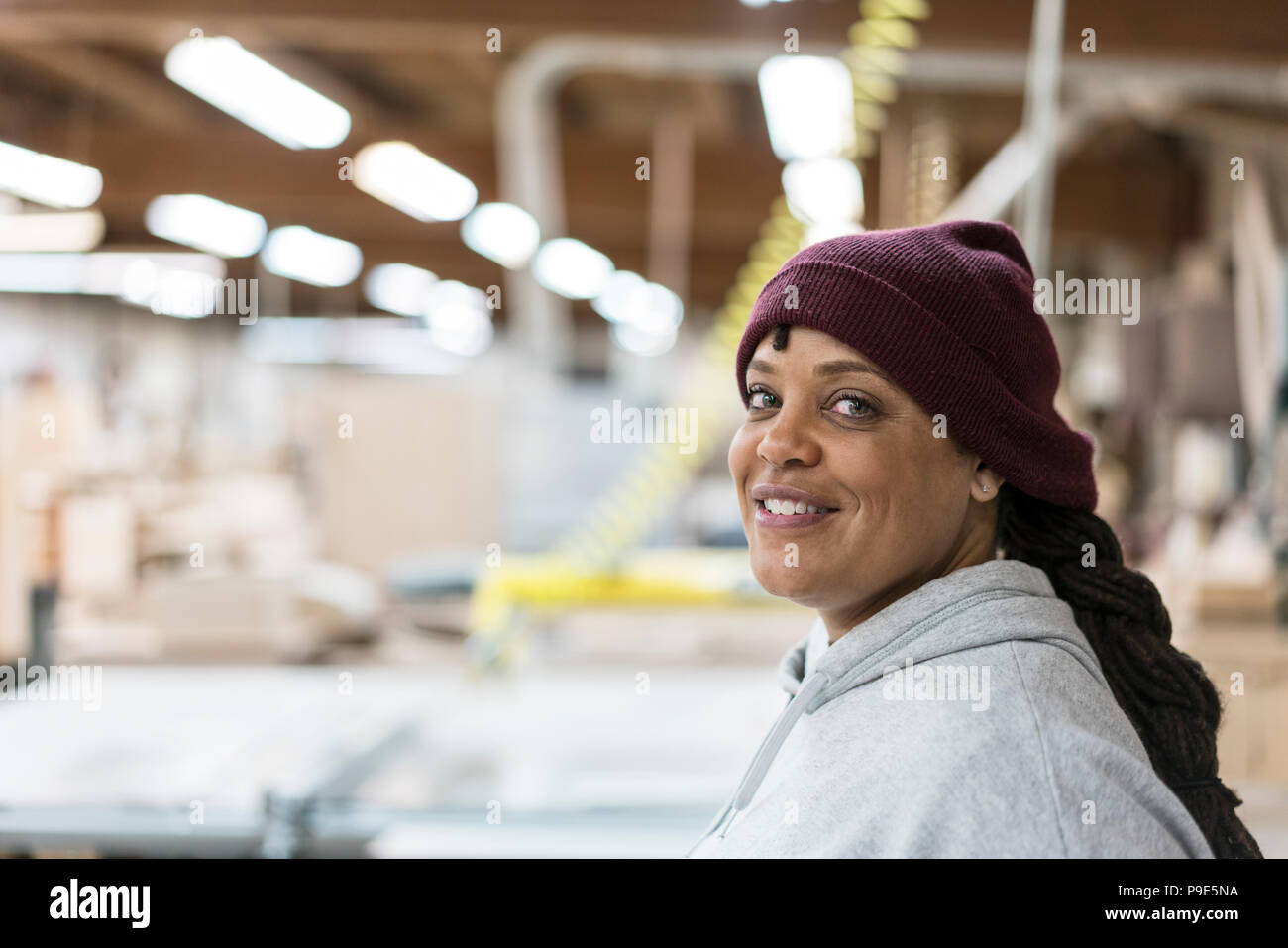 Portrait of a Black woman carpenter in a large woodworking shop Stock ...