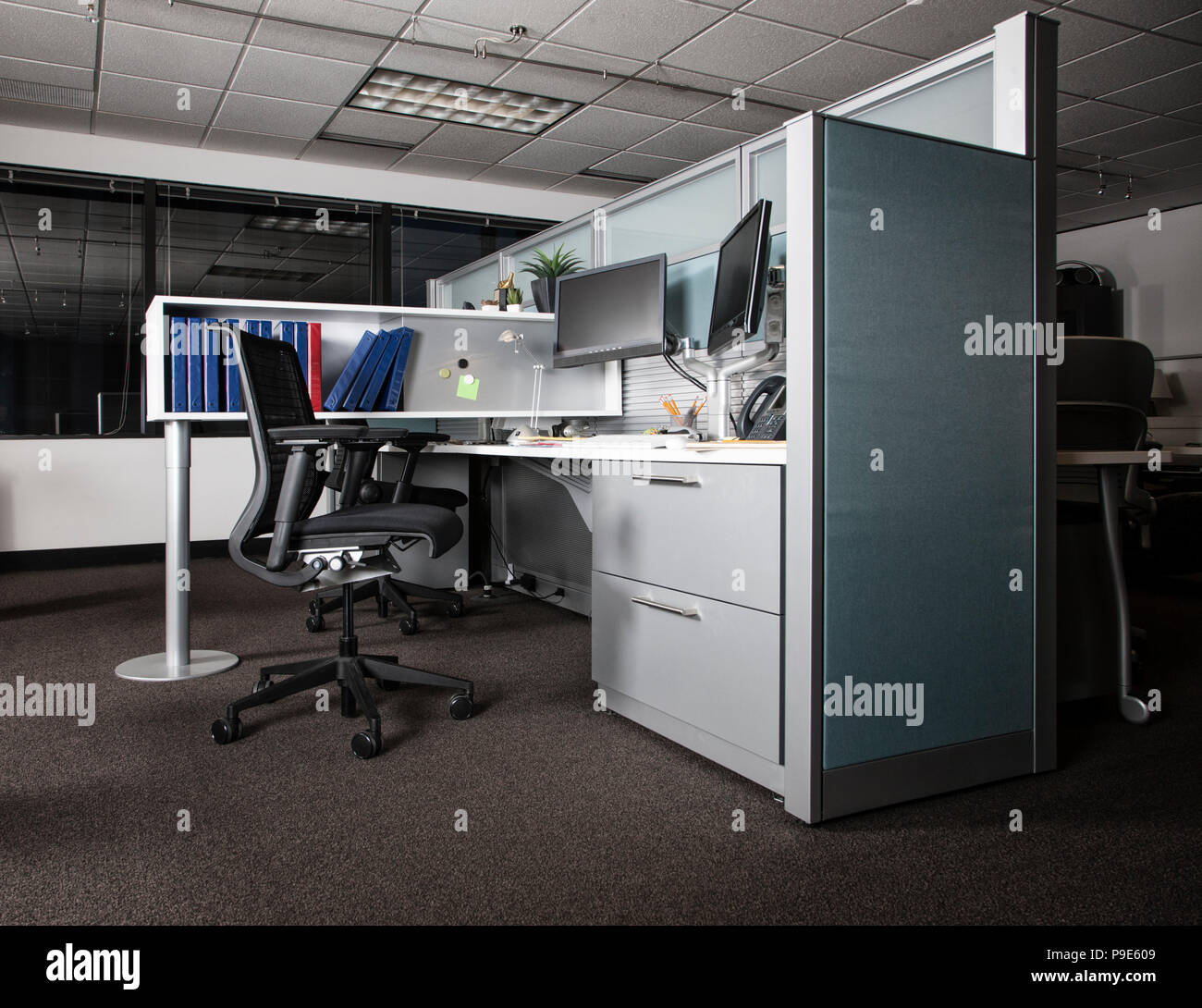 View of an empty cubicle office space at night Stock Photo - Alamy