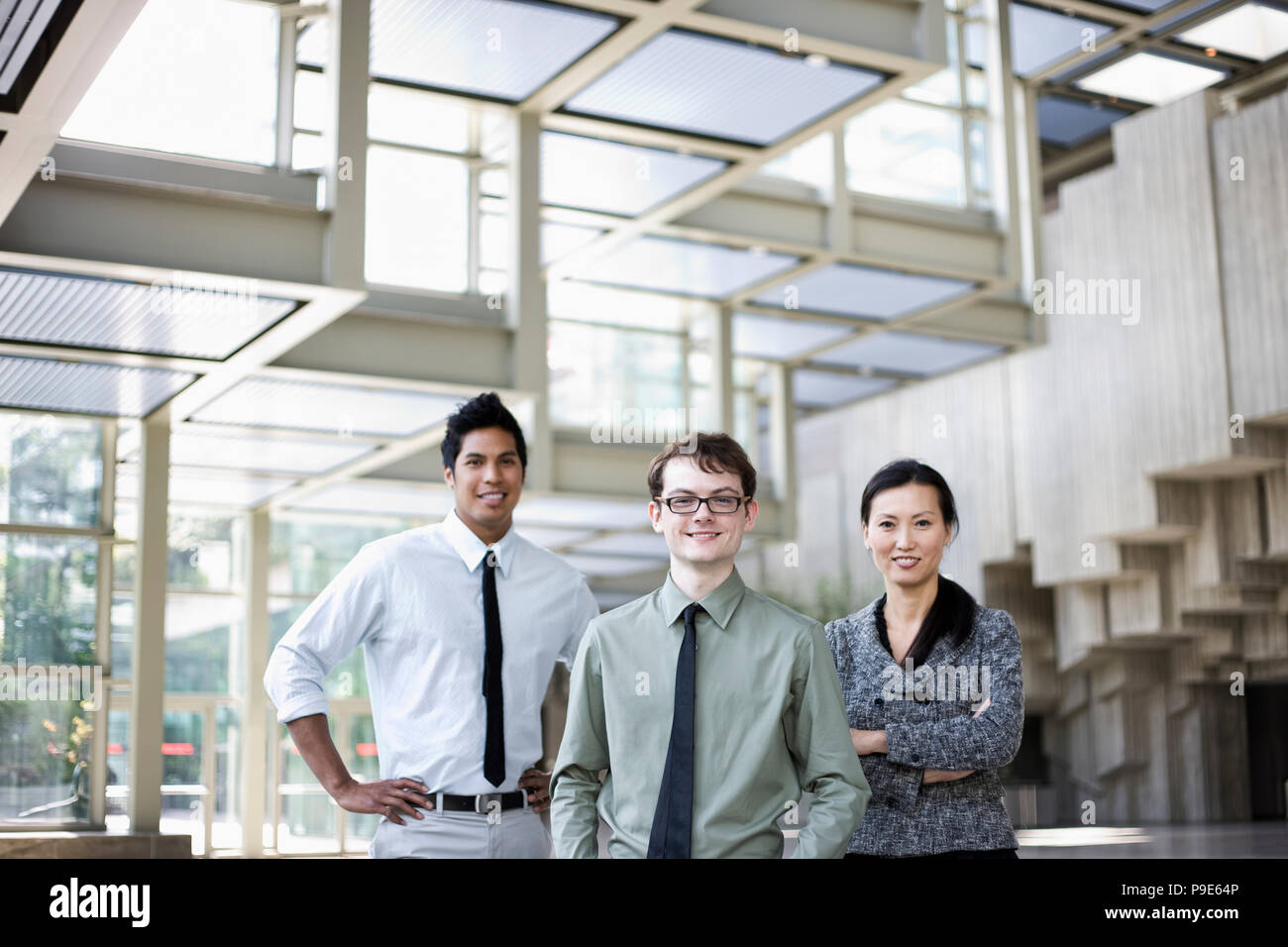 A portrait of a mixed race team of business people standing in the ...