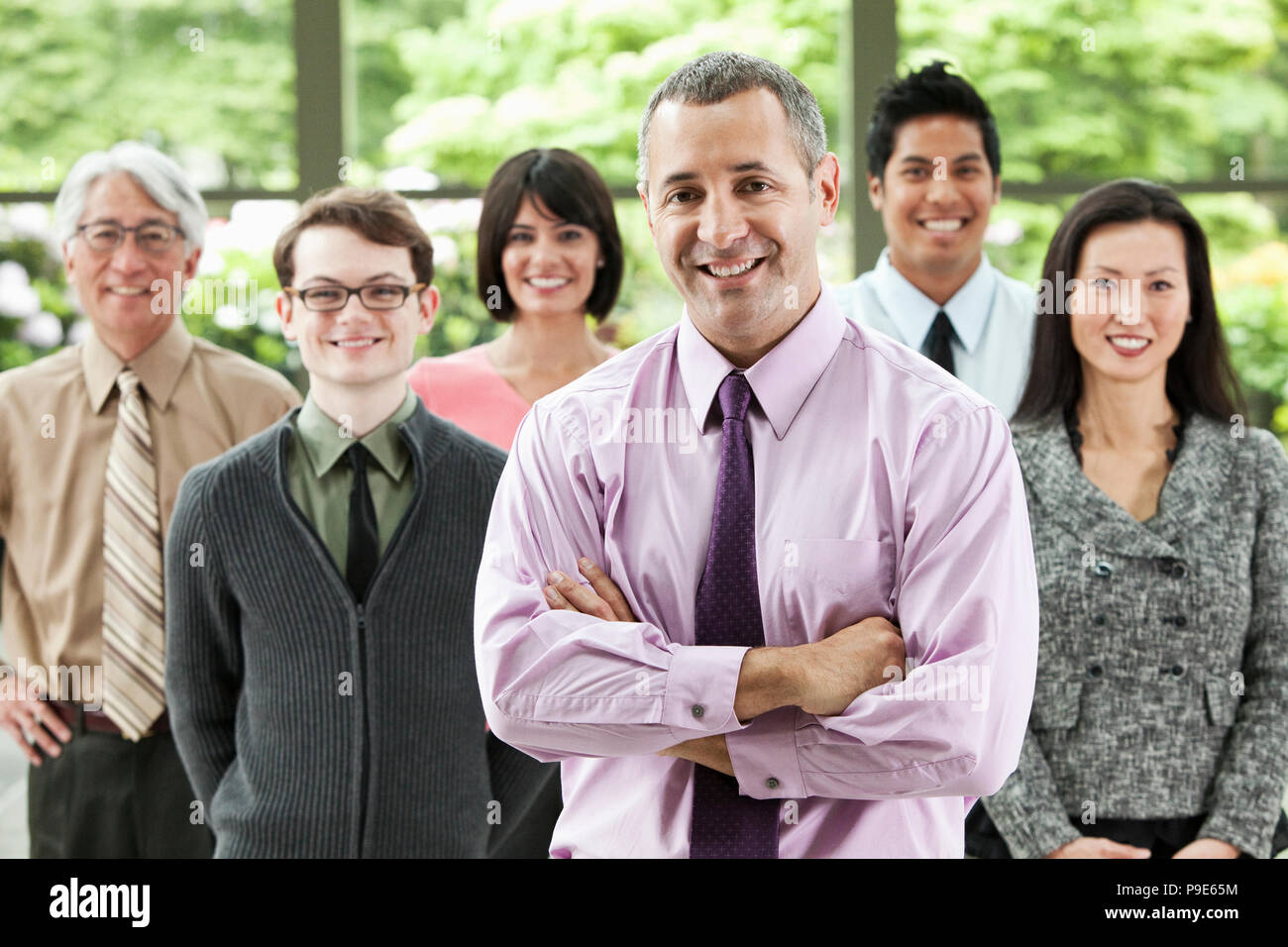 A portrait of a mixed race team of business people with a Caucasian ...