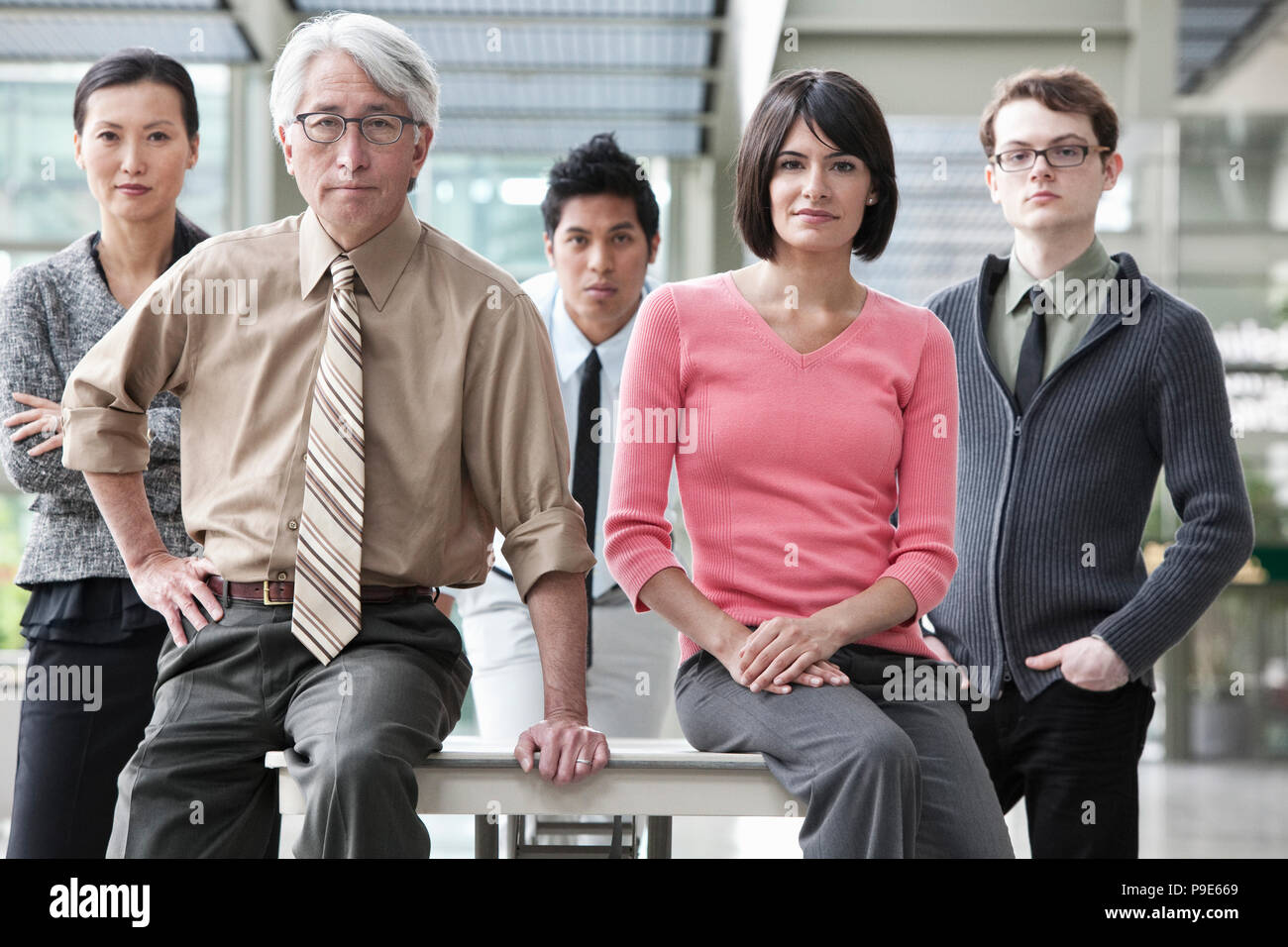 A team portrait of a mixed race group of business people with an Asian ...