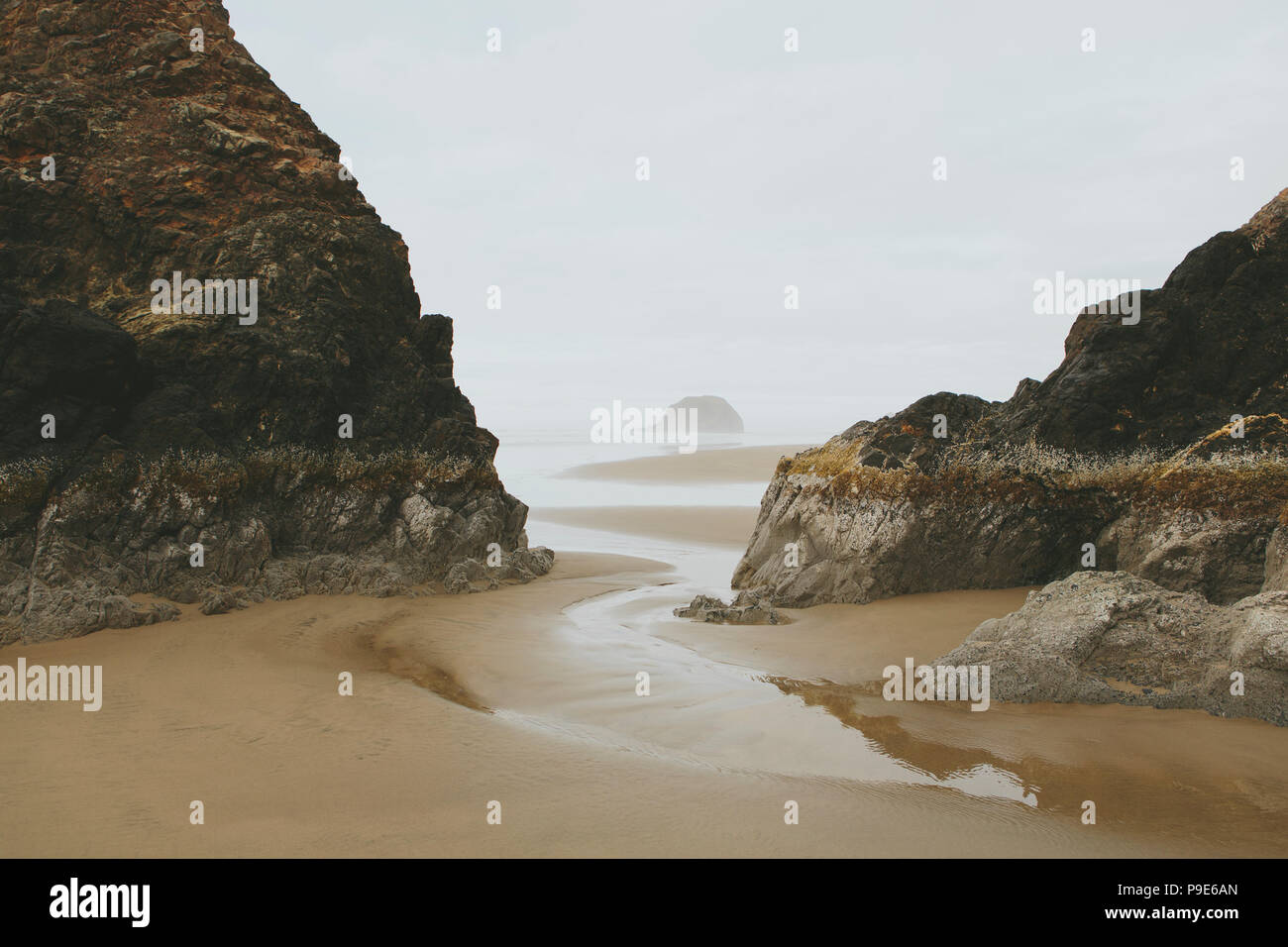Rock on sandy beach in mist hi-res stock photography and images - Alamy