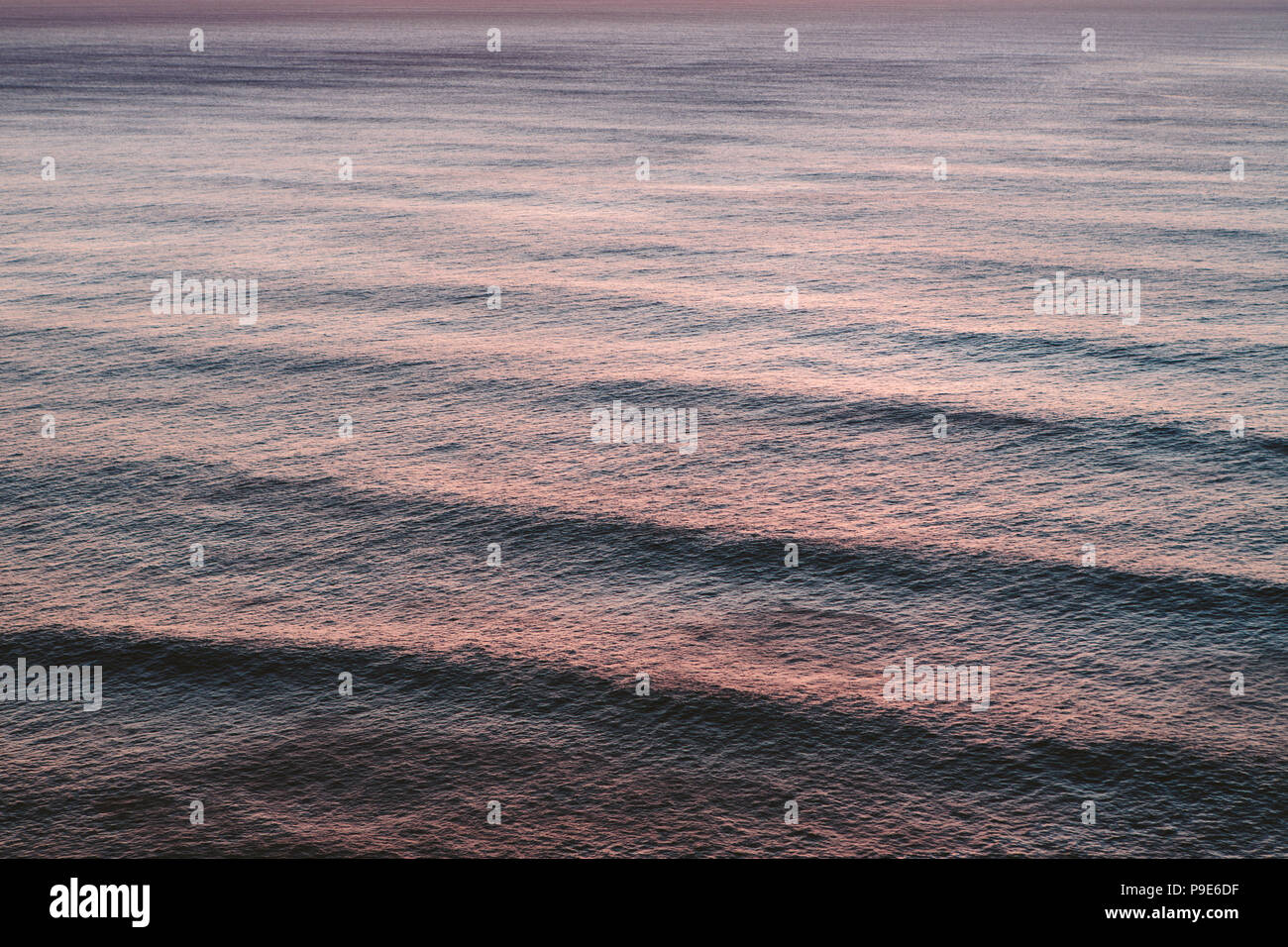 View from above of rolling waves advancing to the shore, a pattern on ...