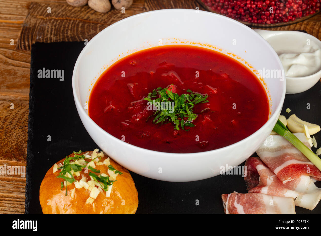 Traditional borsch bowl with garlic bread, bacon and leek Stock Photo ...
