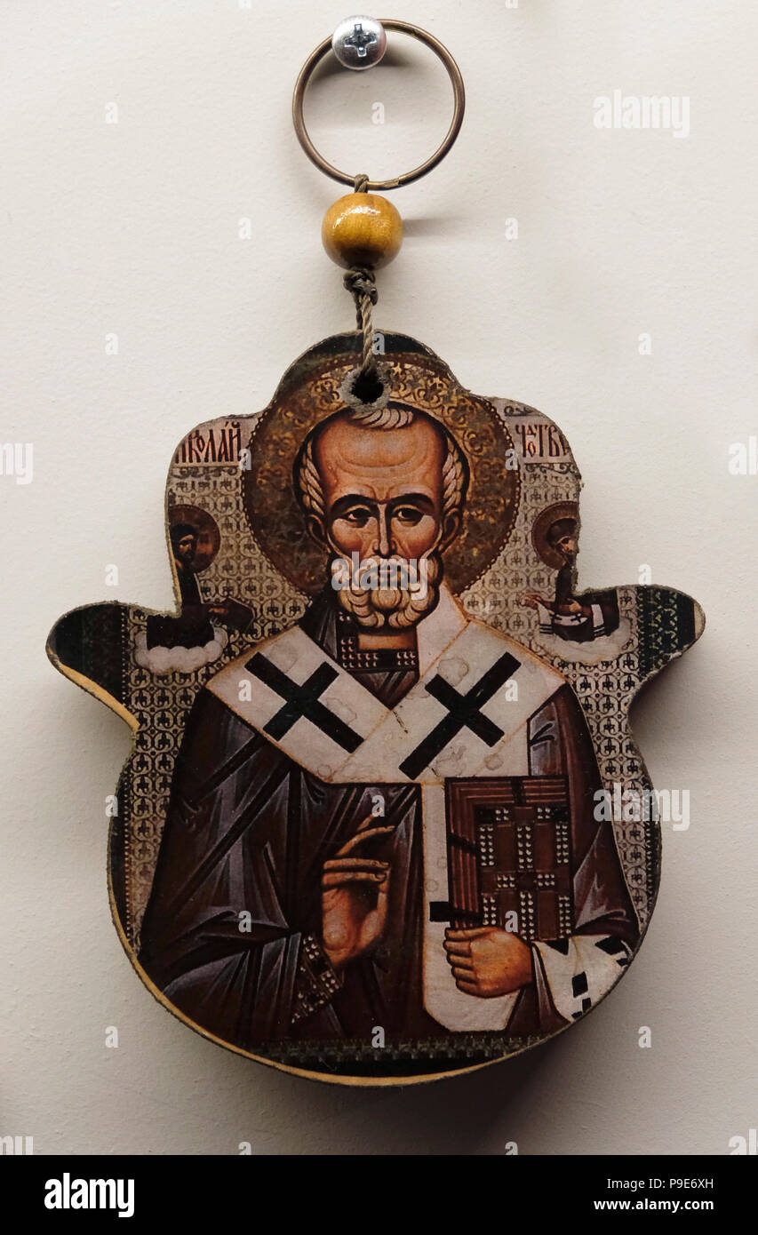 A palm-shaped Hamsa amulet with figure of a Christian saint. The Hamsa ...
